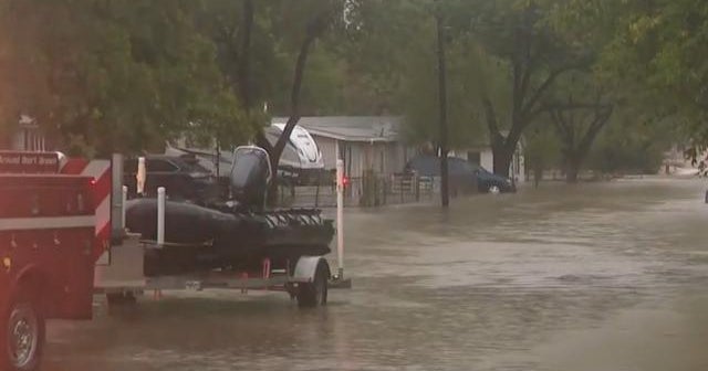 Heavy rain floods Dallas area, storm moves east - CBS News