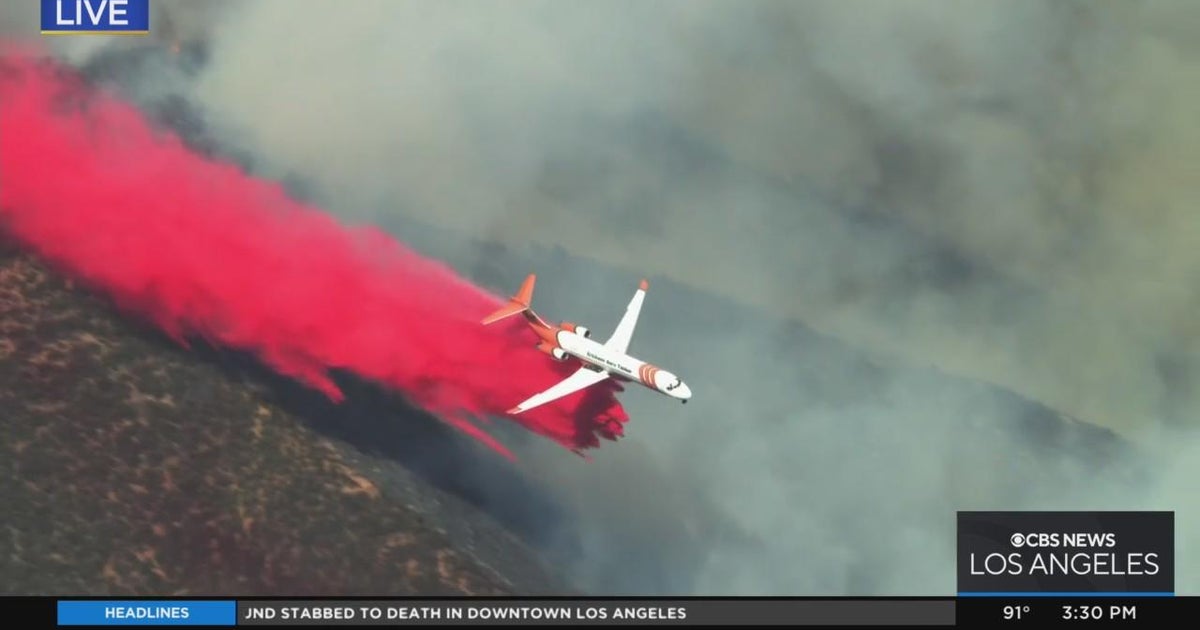 Planes drop fire retardant to stop the East Fire from spreading - CBS ...