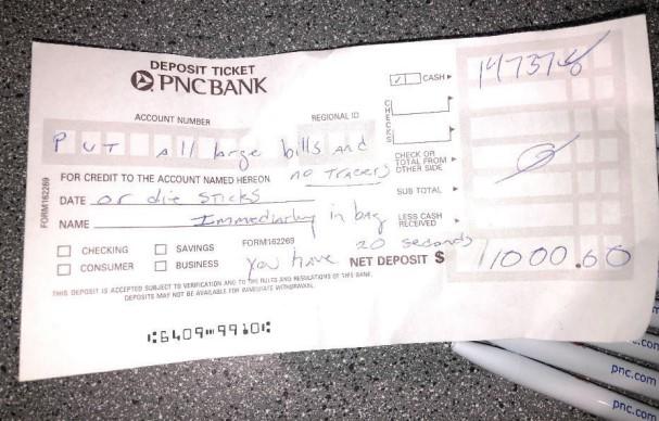 Report of woman handing out money leads to bank robber's arrest - CBS ...