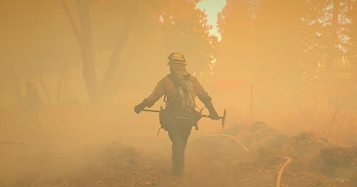 Fire activity more aggressive Tuesday as firefighters work to hold the ...