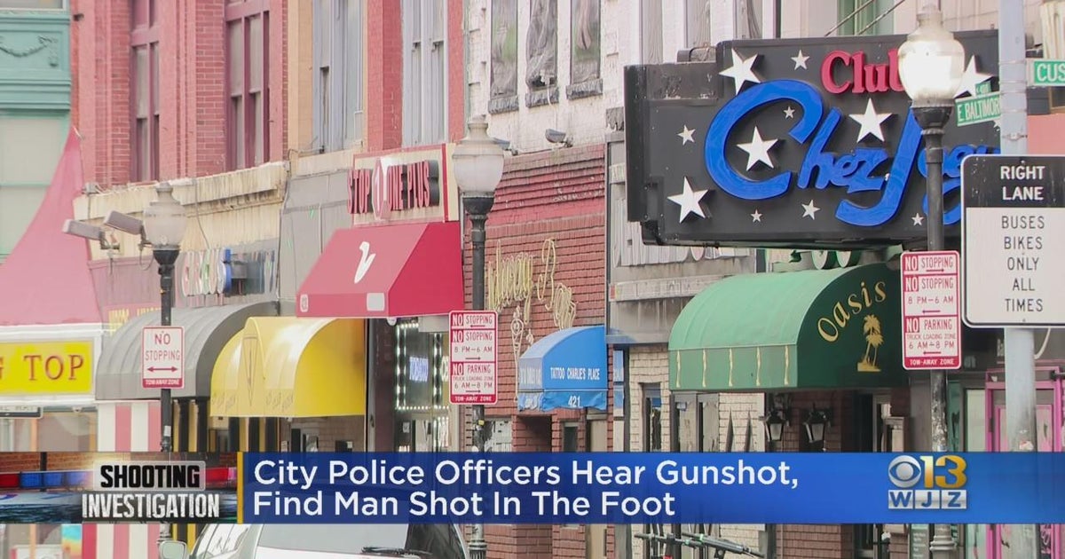 Fight over gun near Baltimore Police headquarters ends with gunshot ...