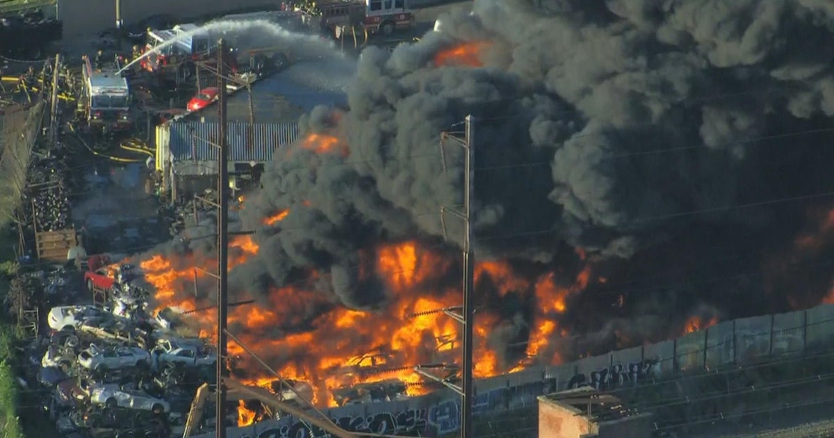 Crews still working to put out hot spots after massive 3-alarm junkyard ...