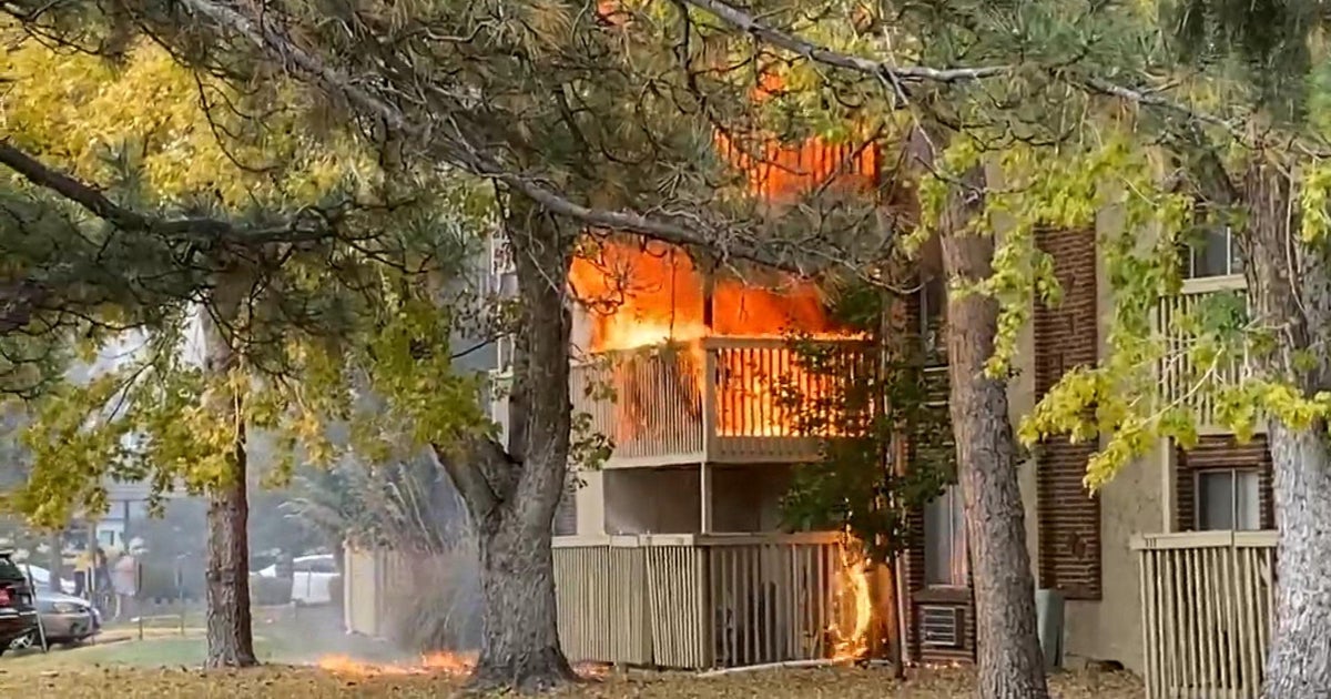 Firefighters rescue residents trapped by flames at condo building in ...