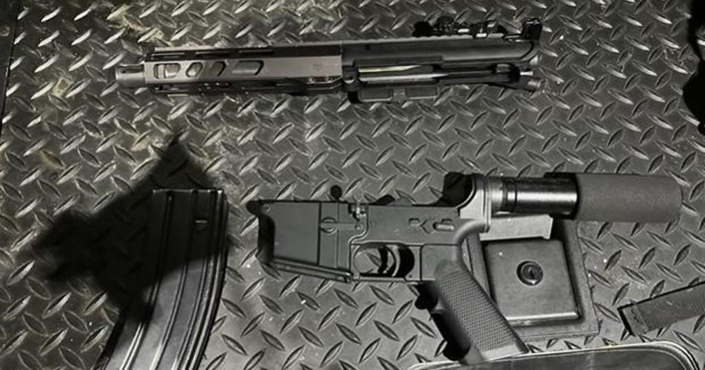 Stolen car with sleeping driver, assault rifle found in middle of ...