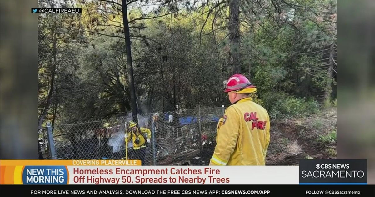 Homeless camp catches fire off Highway 50 - CBS Sacramento