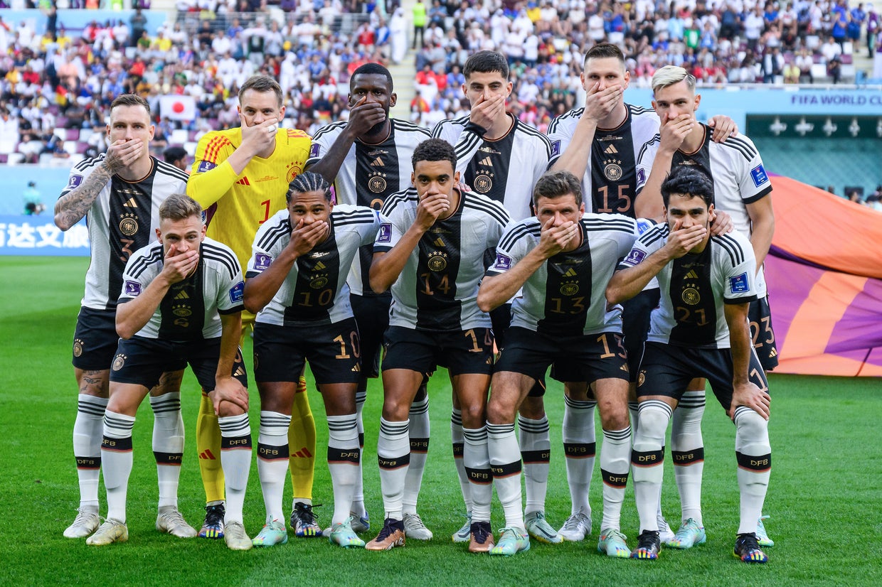 German World Cup players cover mouths in protest of FIFA's ban on "One ...