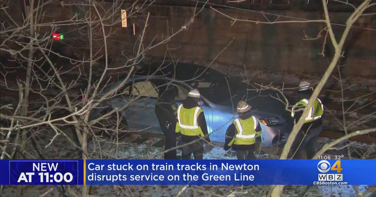 Car stuck on tracks disrupts Green Line service in Newton - CBS Boston