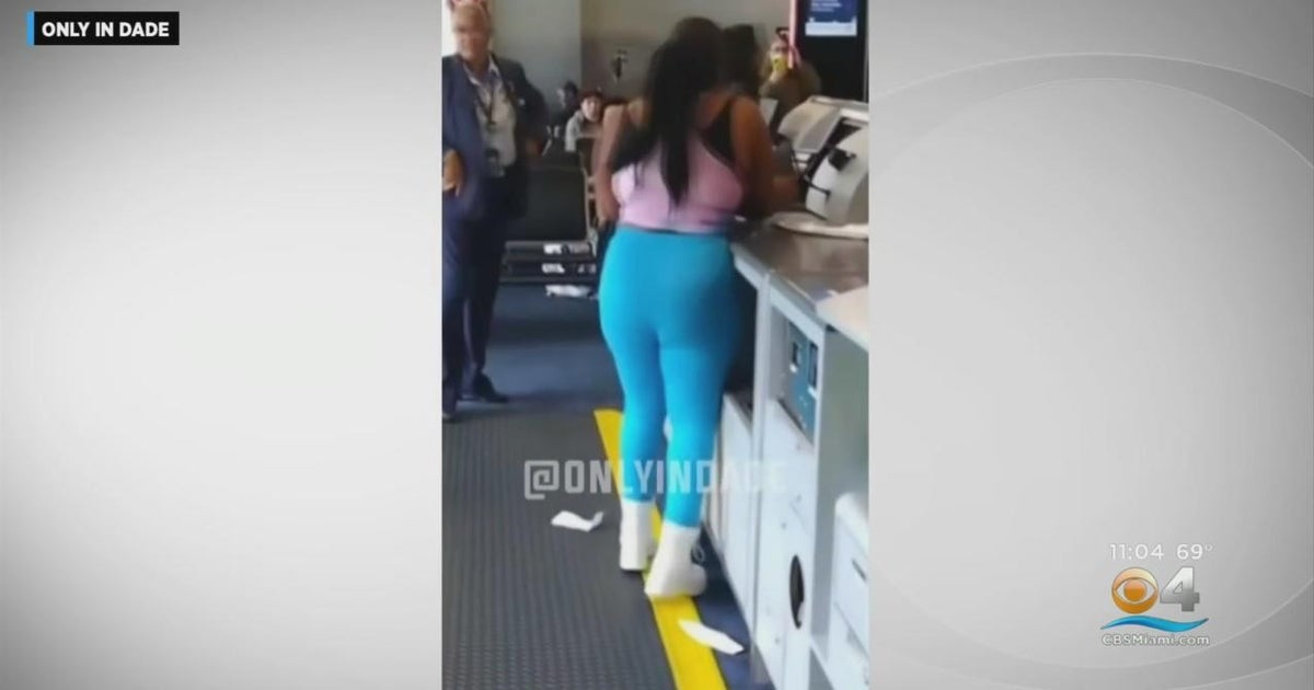 Woman caught on video throwing monitor at ticket counter employee at ...