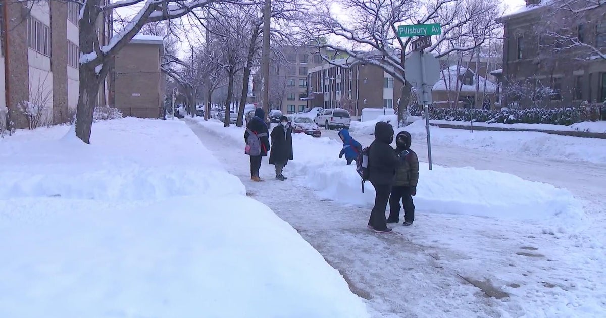 Snow piled against sidewalk creating issues for drivers - CBS Minnesota