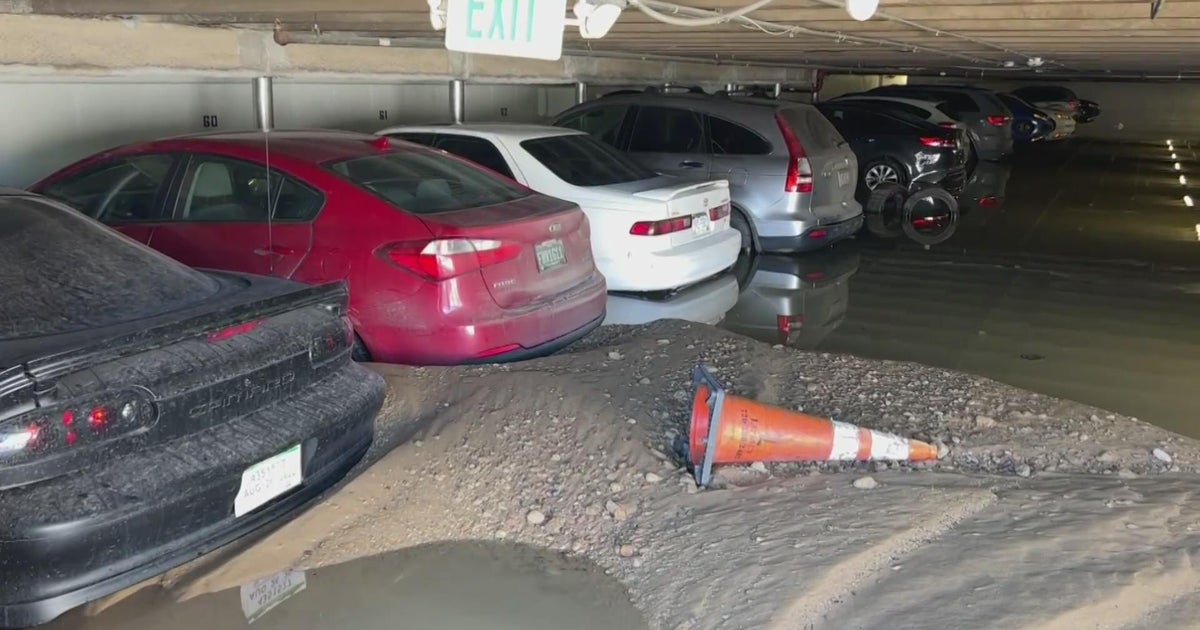 Denver Water main break floods parking garage, cars - CBS Colorado