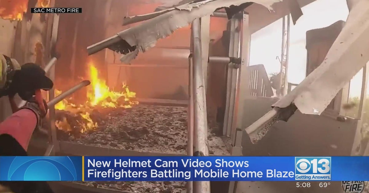 Helmet cam video shows firefighters battling mobile home blaze - CBS ...
