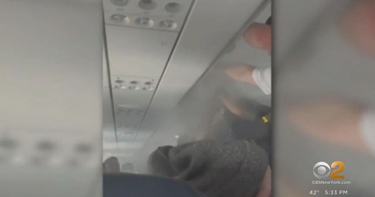 Retired FDNY firefighter helps put out fire on board plane - CBS New York