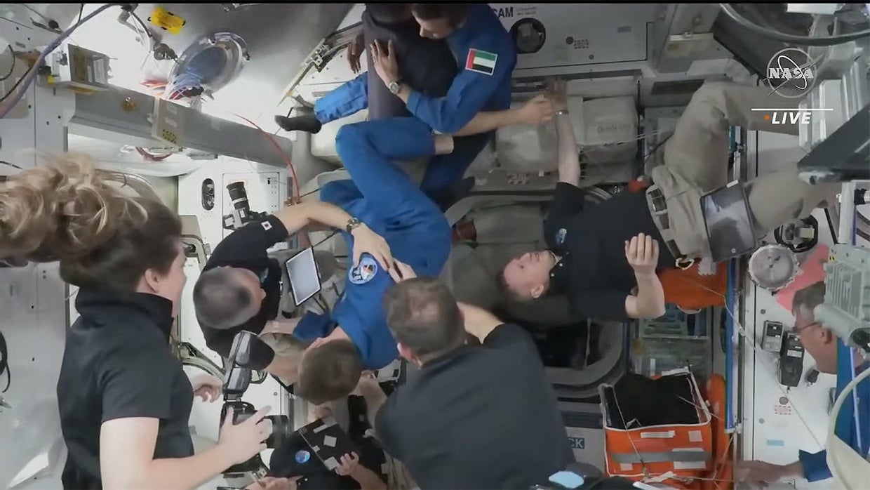 SpaceX Crew Dragon capsule docks at space station, delivering three ...