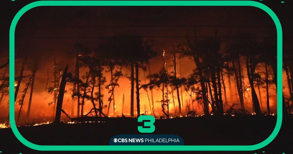 Fire Crews continue to battle a wildfire in Ocean County - CBS Philadelphia
