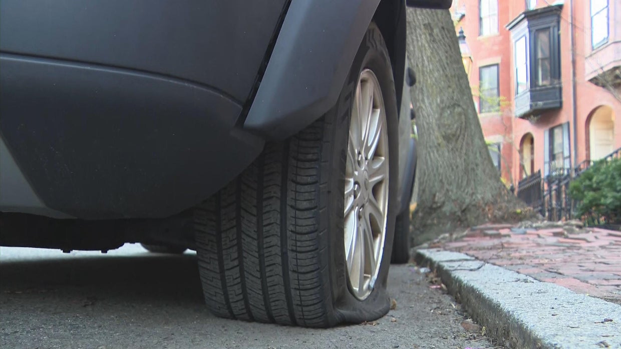 Climate activists deflate tires of 43 SUVs on Beacon Hill - CBS Boston
