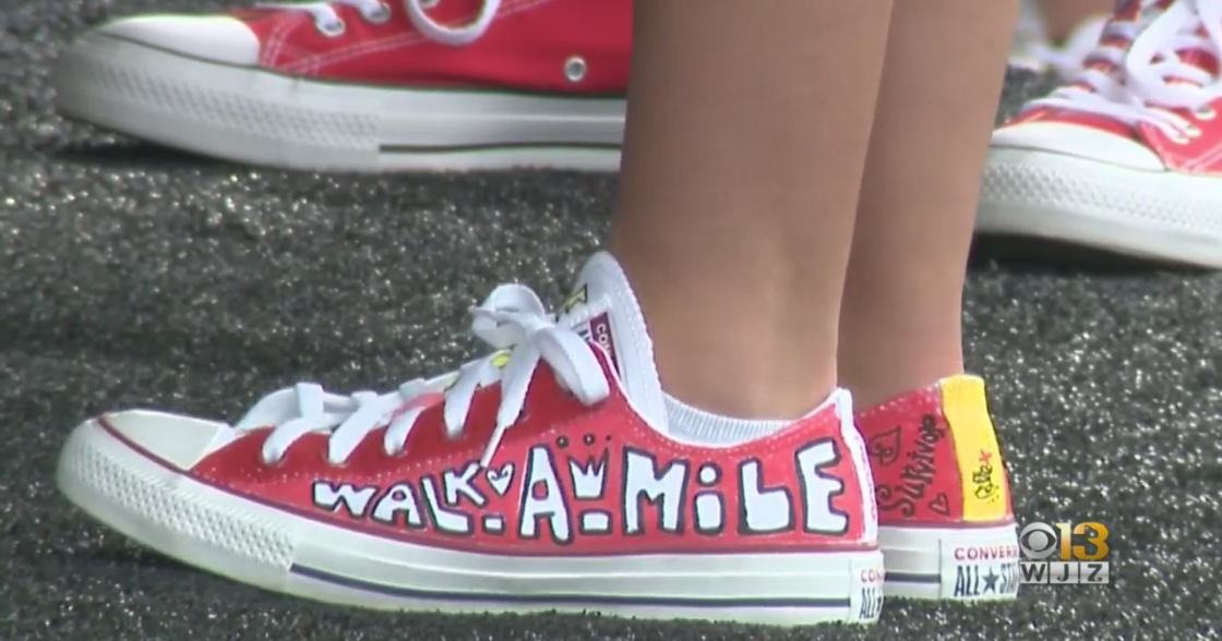 Hundreds of people participate in Walk a Mile in Their Shoes fundraiser ...