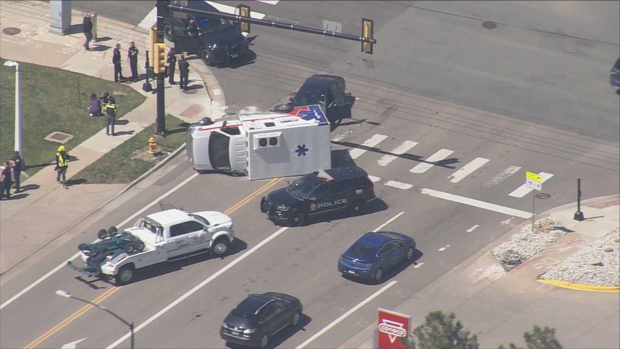 Crash leaves ambulance on its side in Boulder - CBS Colorado