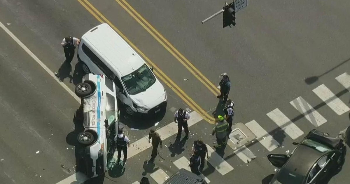 CPD car flips on its side after crash in Oak Park - CBS Chicago