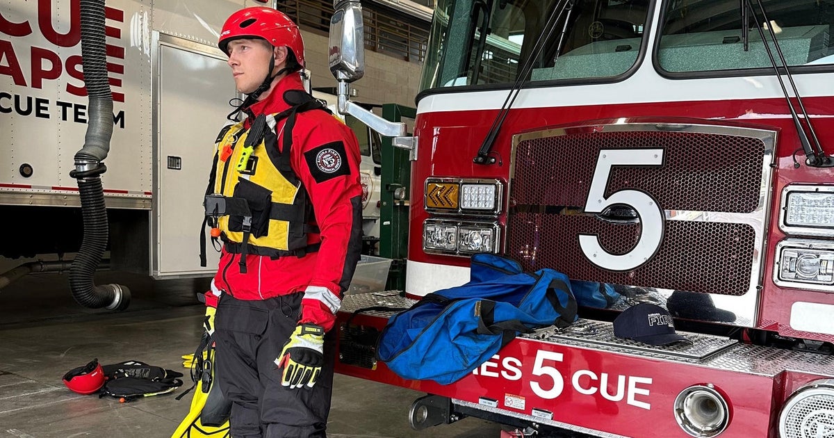 Aurora firefighter rescues man from rising creek waters - CBS Colorado