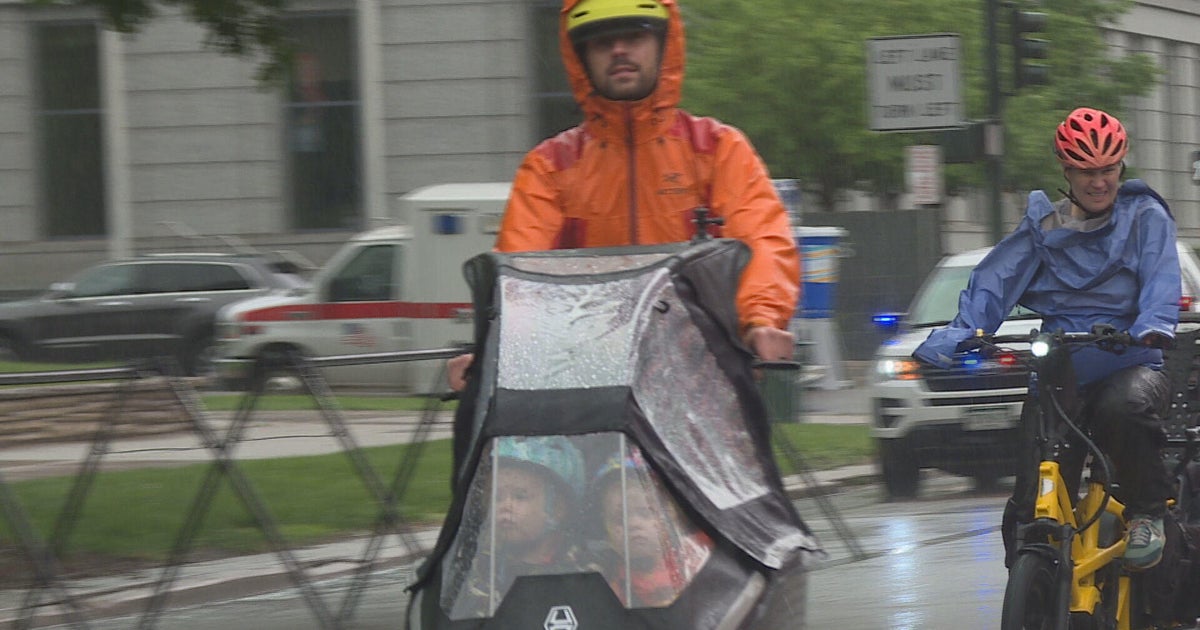 Second Viva Streets sees attendees in ponchos umbrellas in rainy Denver ...