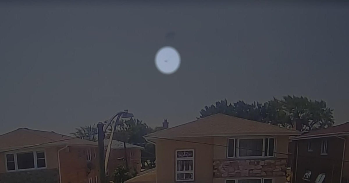 Video shows emergency slide falling from plane near O'Hare - CBS Chicago