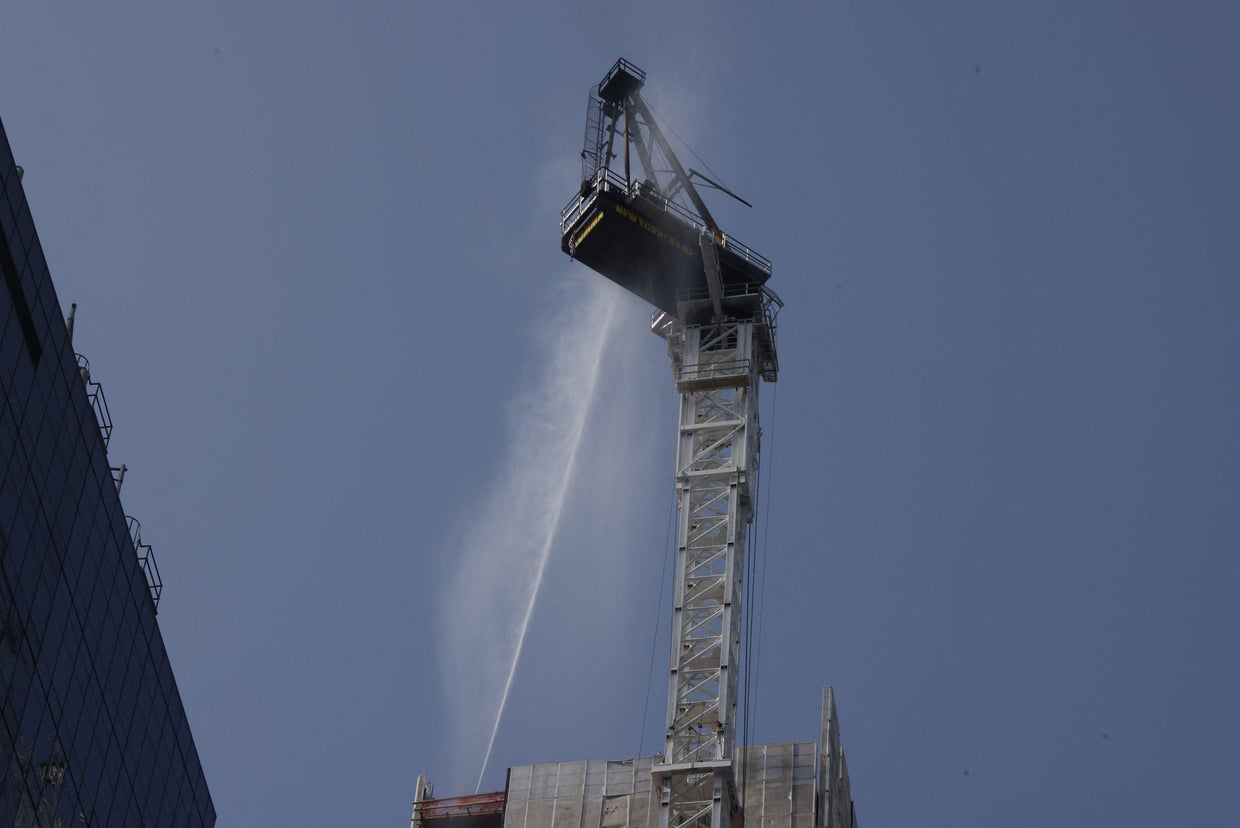 Photos: Crane catches fire, partially collapses in NYC