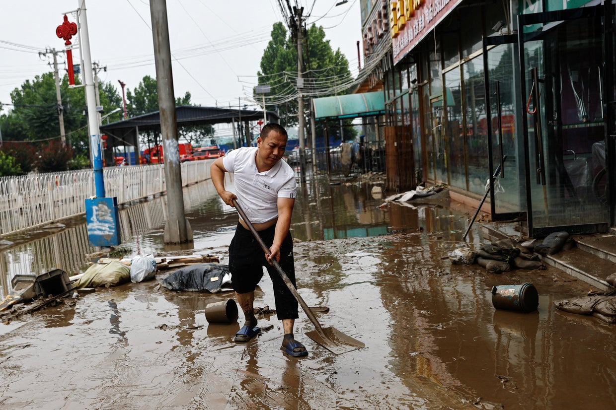 China sees record flooding in Beijing, with 20 deaths and mass ...