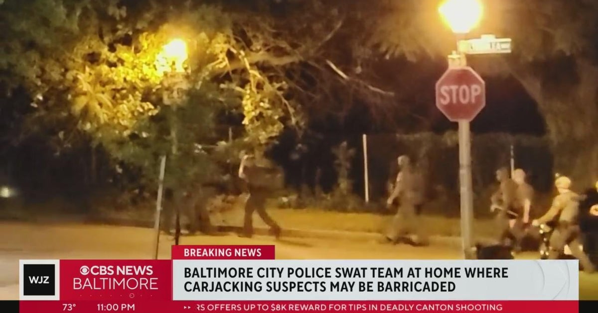 Police: Carjacking suspects shoot at officers, possibly barricaded in ...