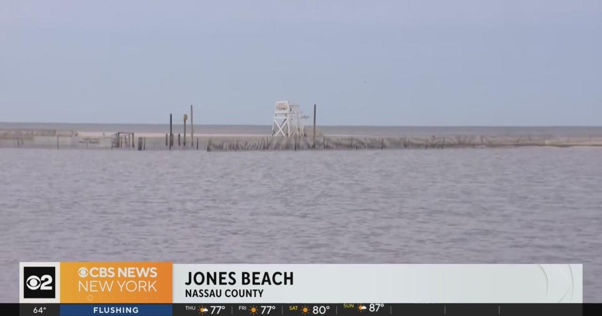 High tide floods Jones Beach, which remains closed to swimming - CBS ...