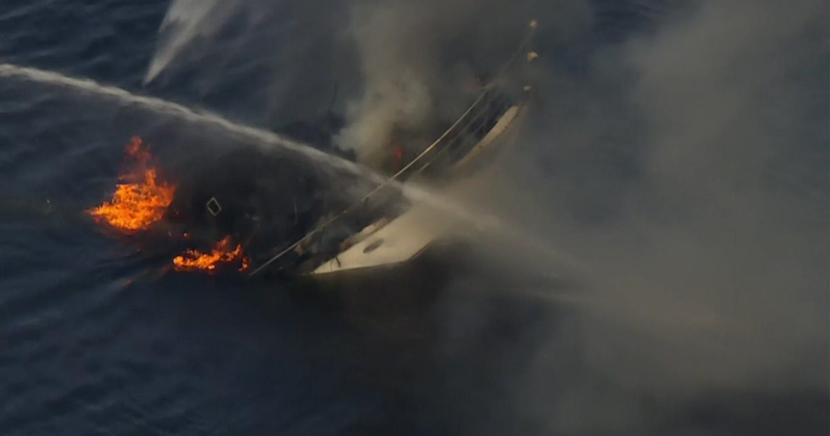 Boat sinks after catching fire near City Island - CBS New York
