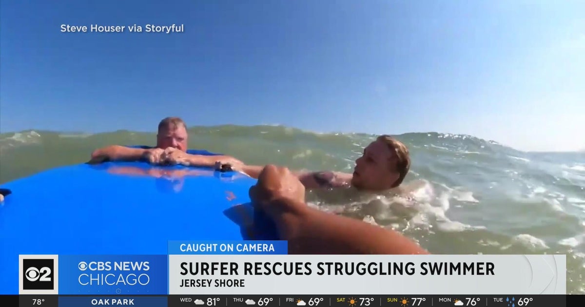Surfer saves swimmer from rip currents - CBS Chicago