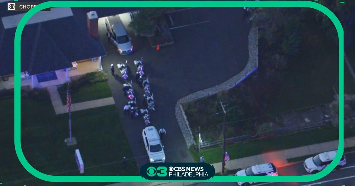 Philadelphia police officer's body arrives at funeral home - CBS ...