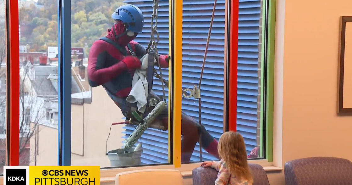 Superhero window washers spend Halloween rappelling down UPMC Children ...