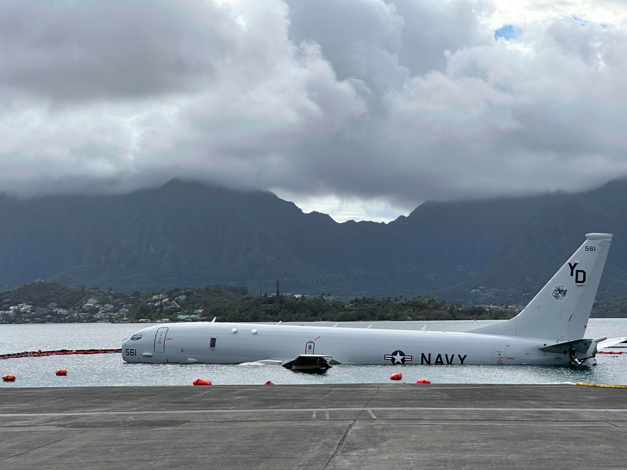 Underwater video shows Navy spy plane's tires resting on coral after ...