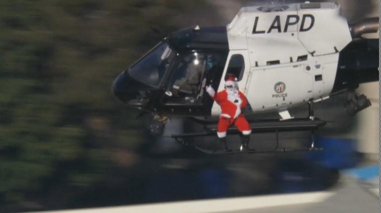 Santa hitches a ride with LAPD to deliver toys to children - CBS Los ...