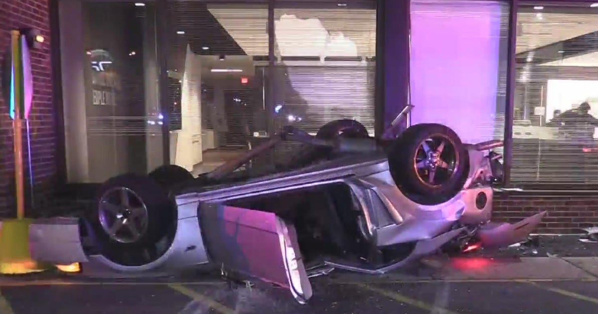1 hospitalized after car hits building, flips over in Skokie - CBS Chicago