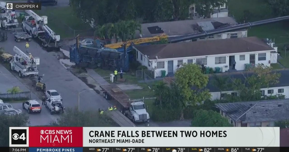 Crane overturns between residential buildings in NE Miami-Dade - CBS Miami