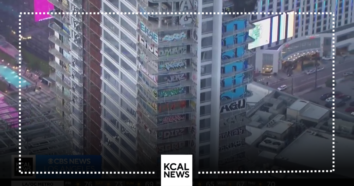 Crews start cleaning up graffiti-filled high-rise towers in Downtown ...