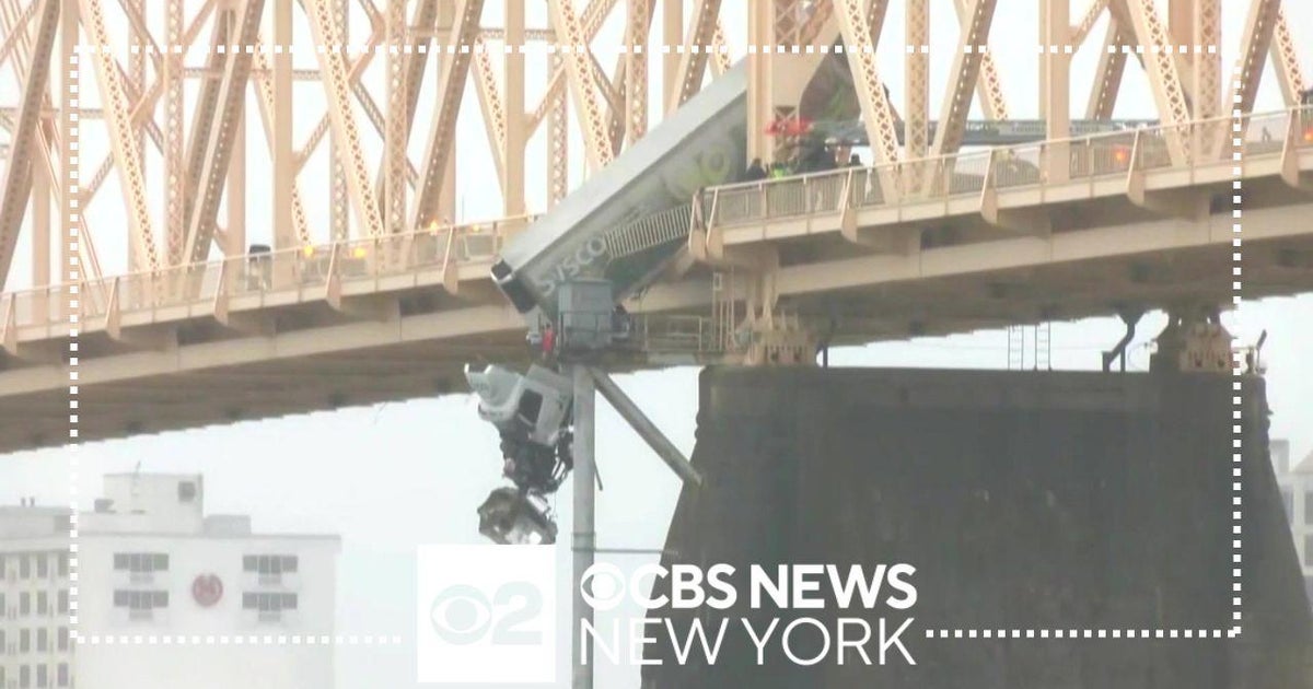 Rescuers pull driver from semi-truck dangling off bridge in Kentucky ...