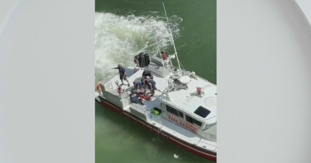 Woman rescued after falling off boat near Brickell - CBS Miami