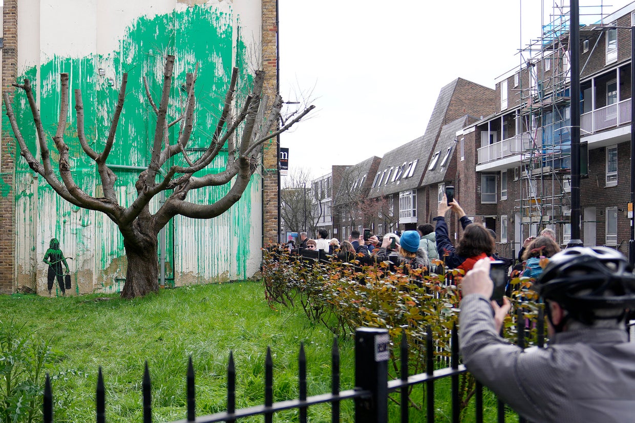 Banksy has unveiled a new mural that many view as a message that ...