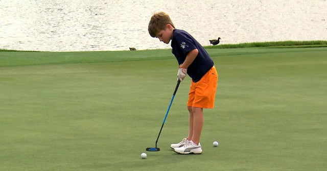 6-year-old golfer with one arm inspires on and off fairway - CBS News