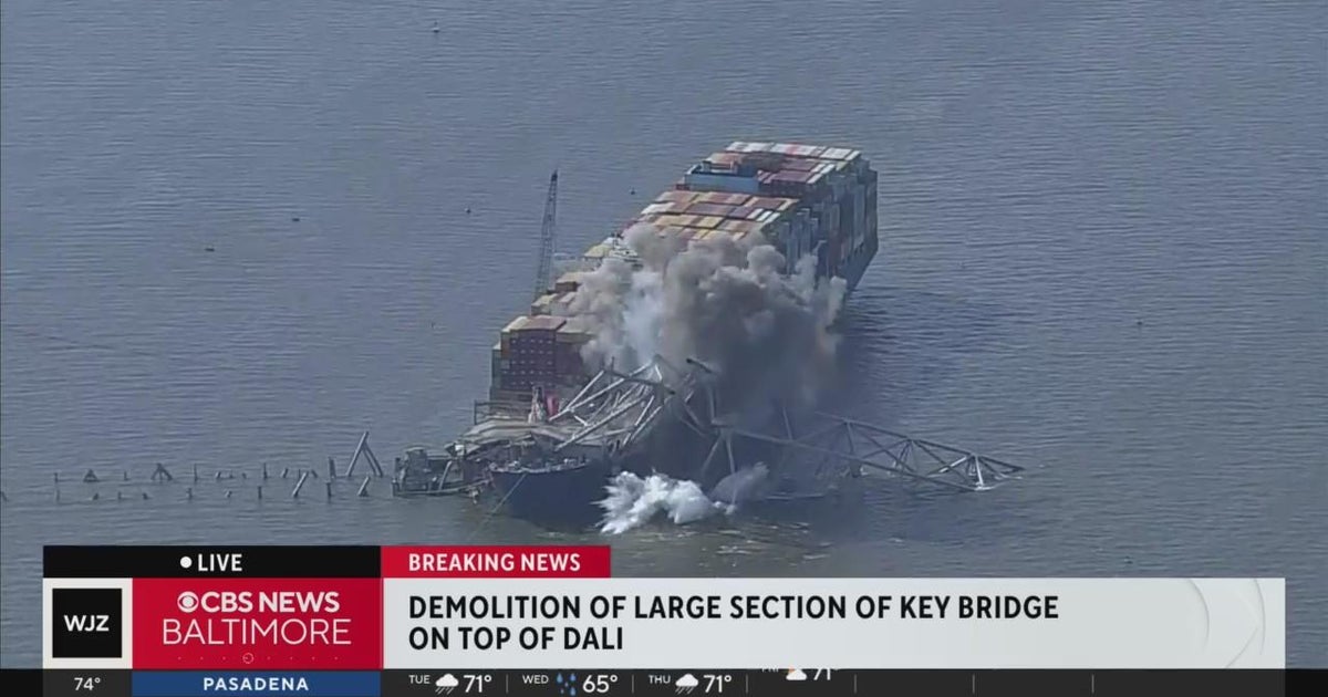 Explosions demolish large piece of Key Bridge from top of container ...