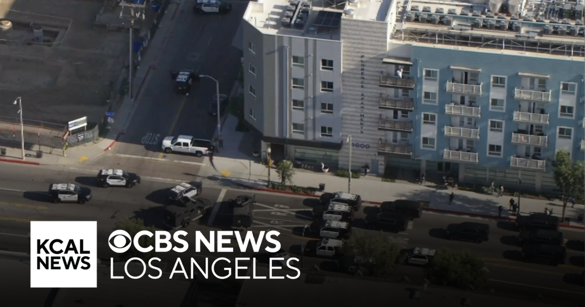Possibly armed shooting suspect barricaded inside of South LA apartment ...