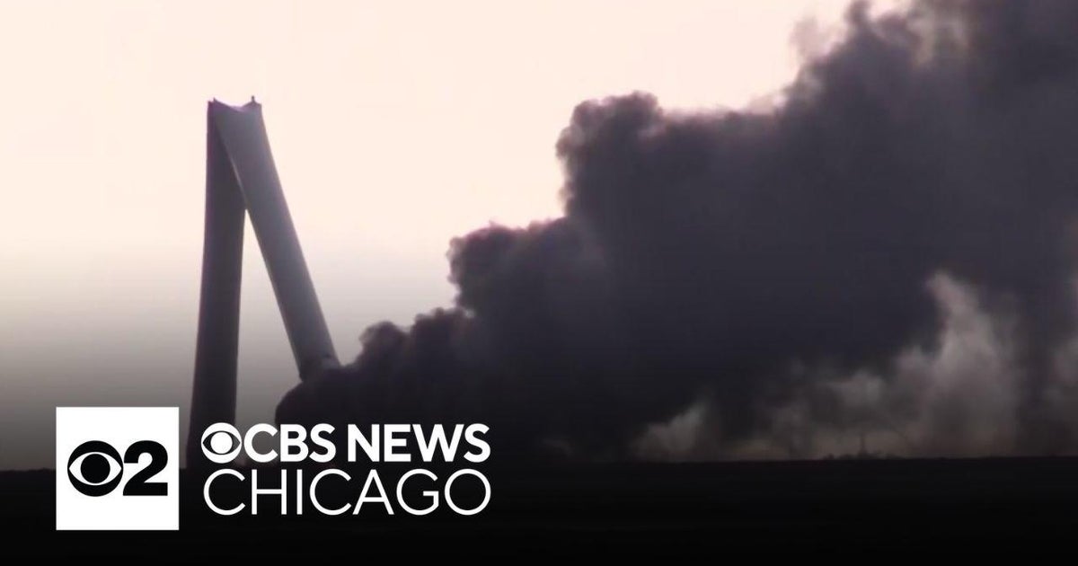 Windmill catches fire after being bent by tornado in Iowa - CBS Chicago
