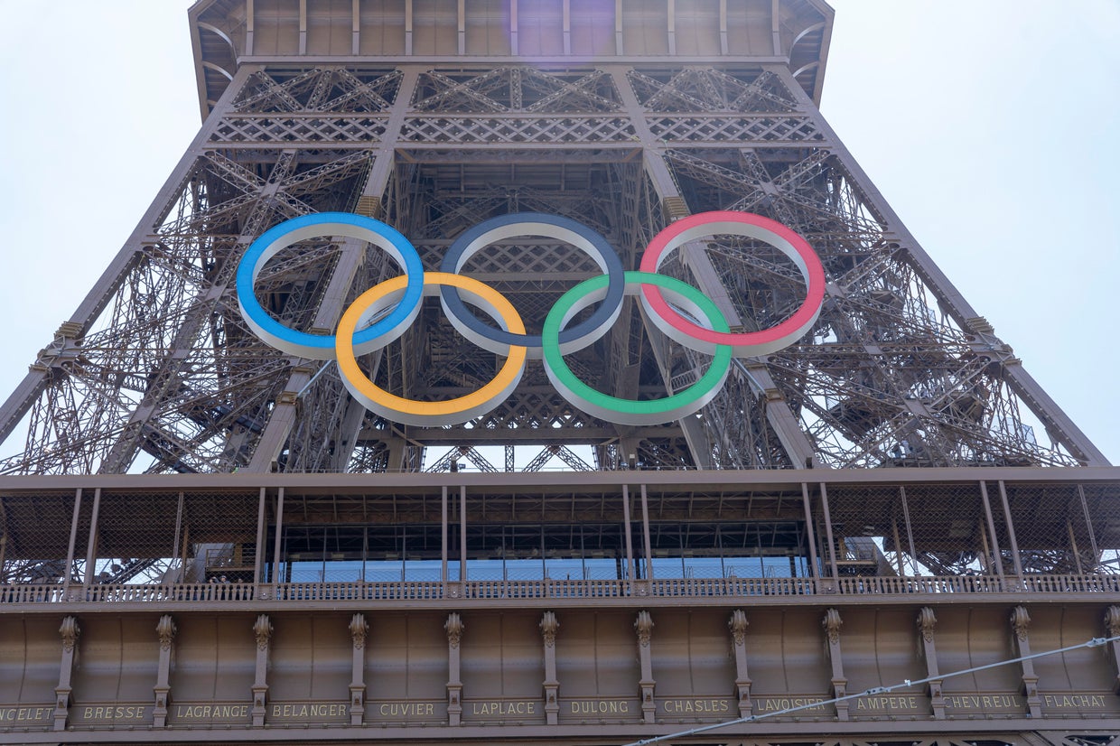 Olympic rings mounted on the Eiffel Tower ahead of Summer Games - CBS News