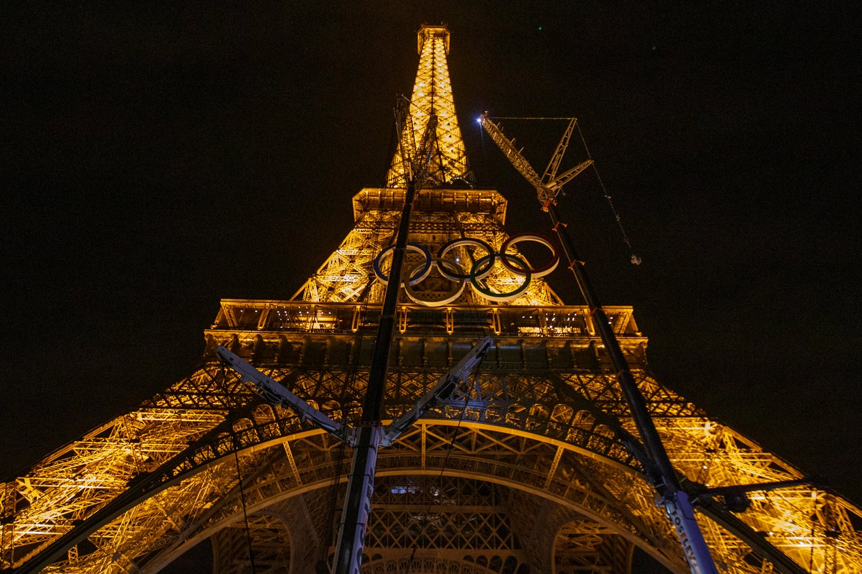 Olympic rings mounted on the Eiffel Tower ahead of Summer Games - CBS News