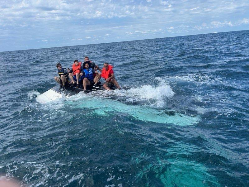 Coast Guard rescues 5 men after boat capsizes 11 miles off Florida ...