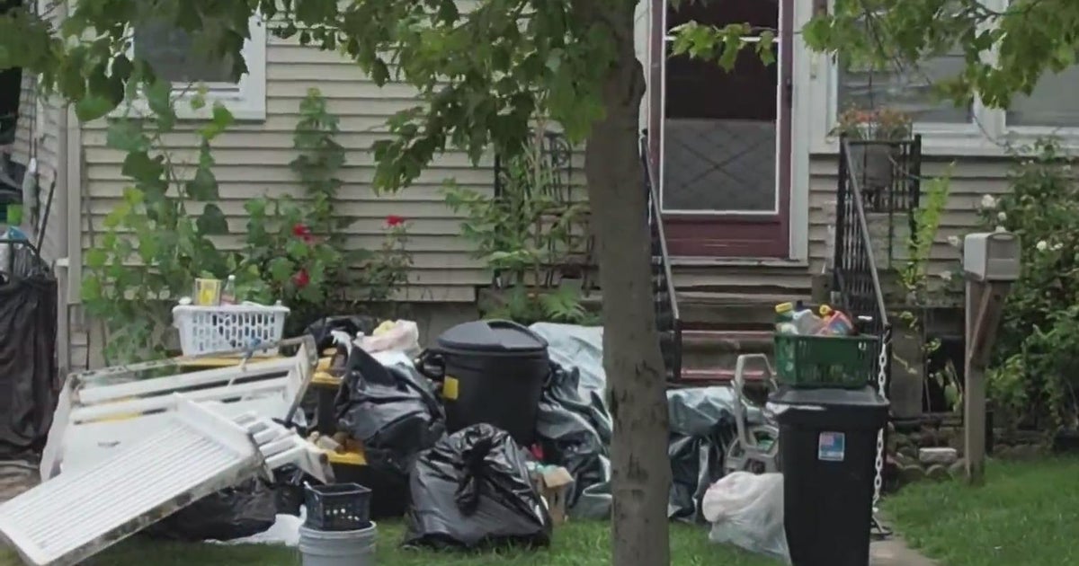 Michigan homeowner gets help with trash cleanup on property - CBS Detroit