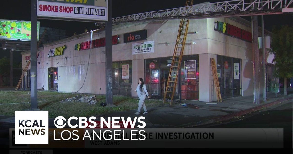Firefighters put out flames at a West Adams strip mall where 3 ...